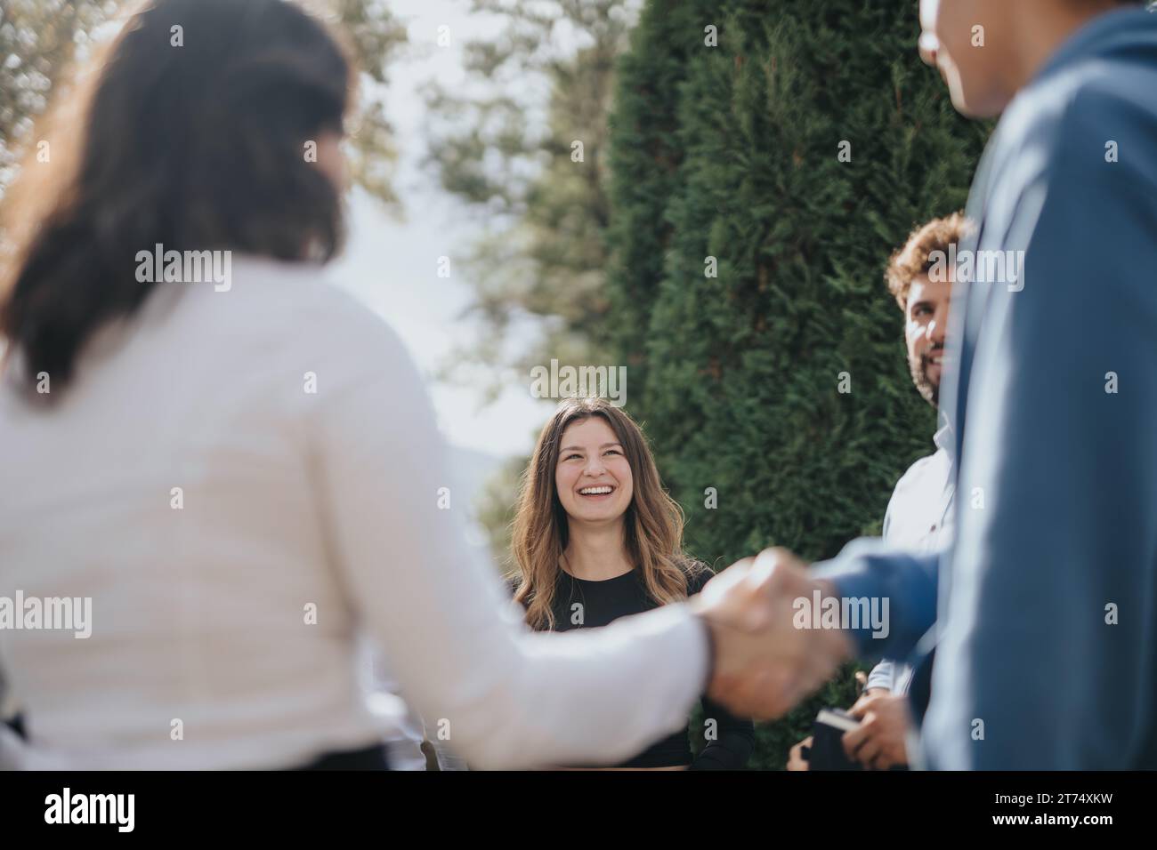University colleagues prepare for exams in a park, discussing subject ...