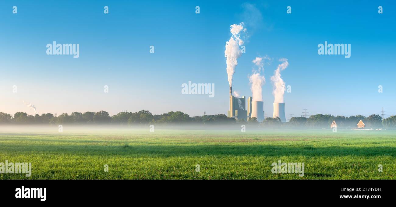 The Schkopau lignite-fired power station in the morning, green meadow ...