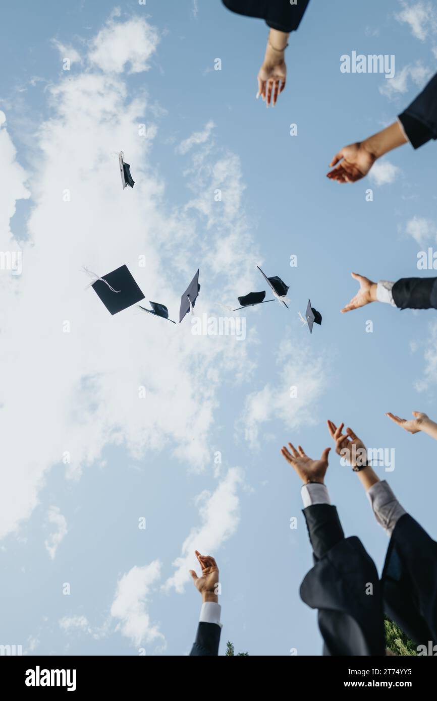 Students throwing caps after achieved university milestones and taken ...