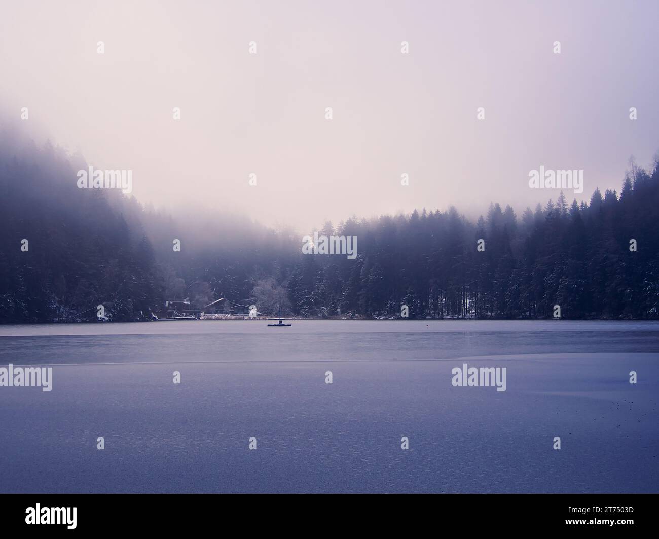 Alpine frozen misty lake landscape Stock Photo - Alamy
