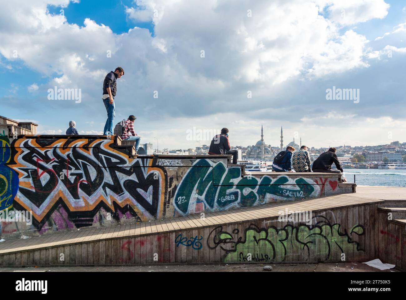 Istanbul, Turkey, People relaxing at a waterfront of Karakoy ...