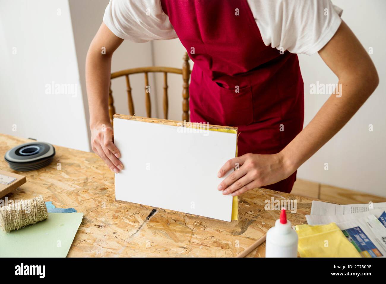 Woman s hand holding mold wooden desk Stock Photo - Alamy