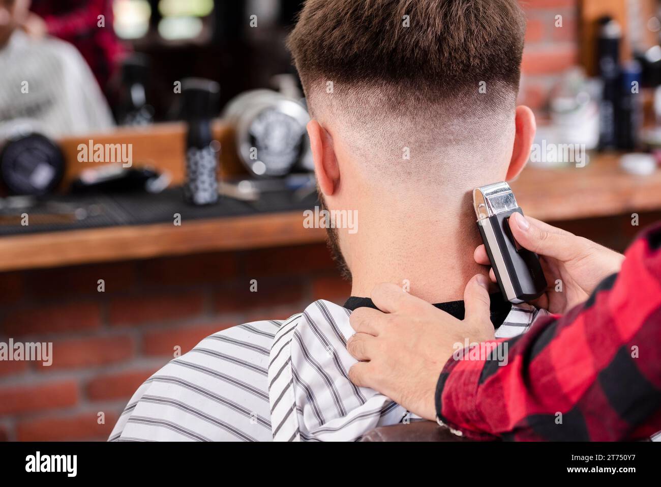 Back view barber trimming hair Stock Photo - Alamy