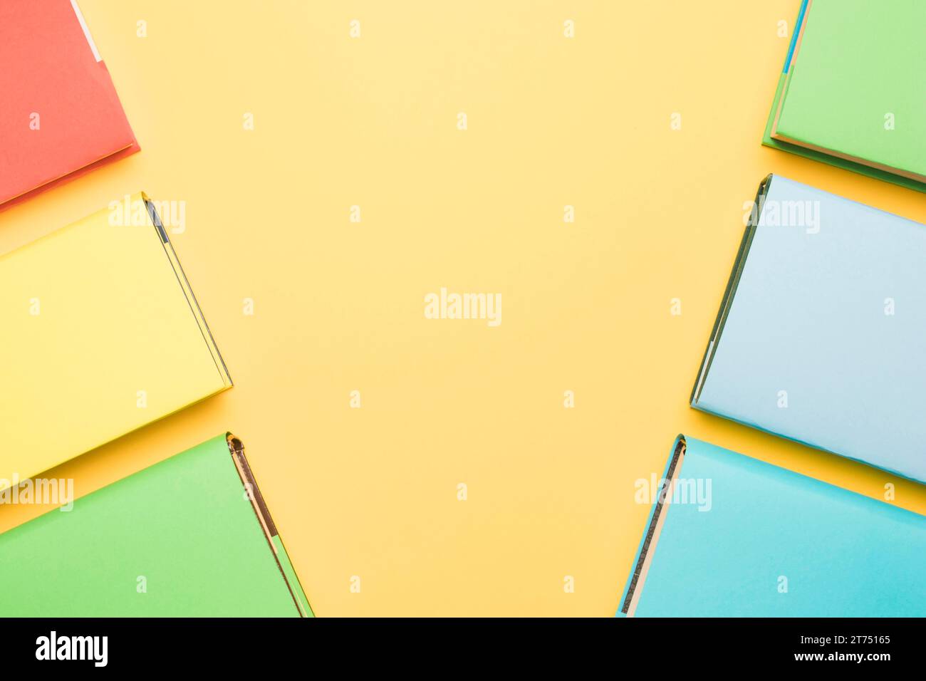 Books with colorful covers laid out lines Stock Photo - Alamy