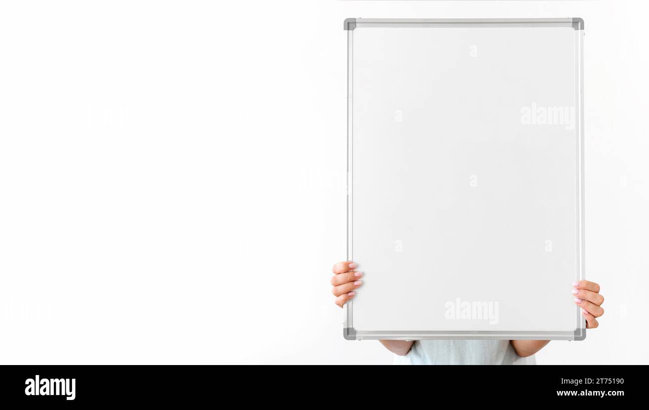 Close up hands holding blank board Stock Photo - Alamy