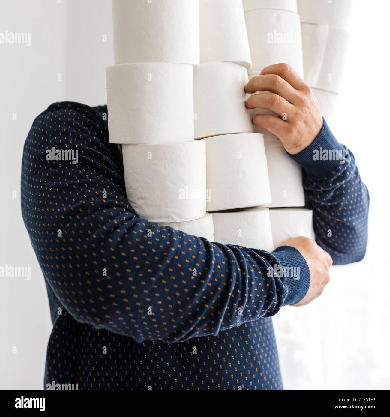 Close up male with stack toilet paper Stock Photo - Alamy