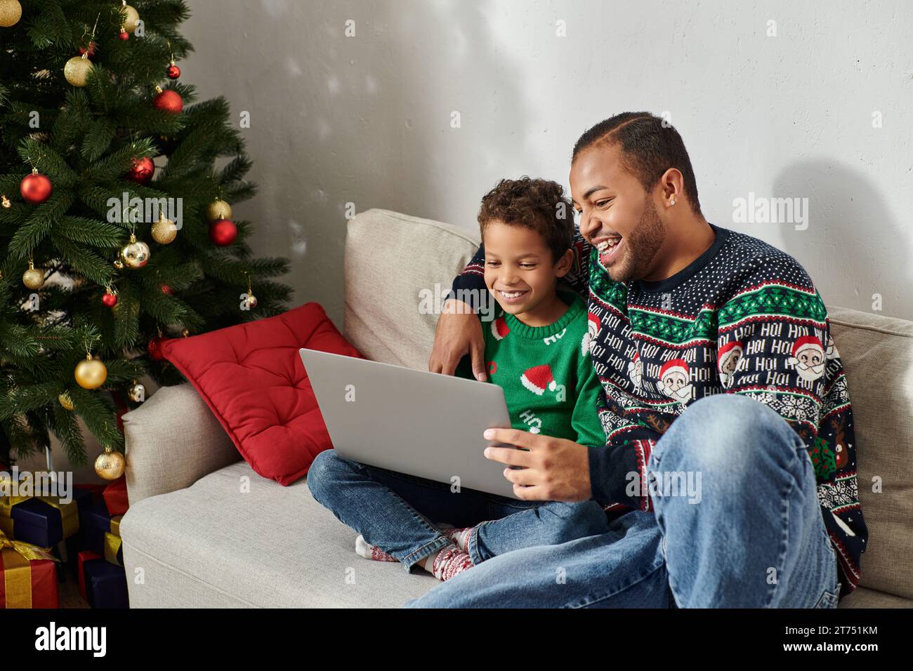 happy cute african american boy watching Christmas comedy movie on ...