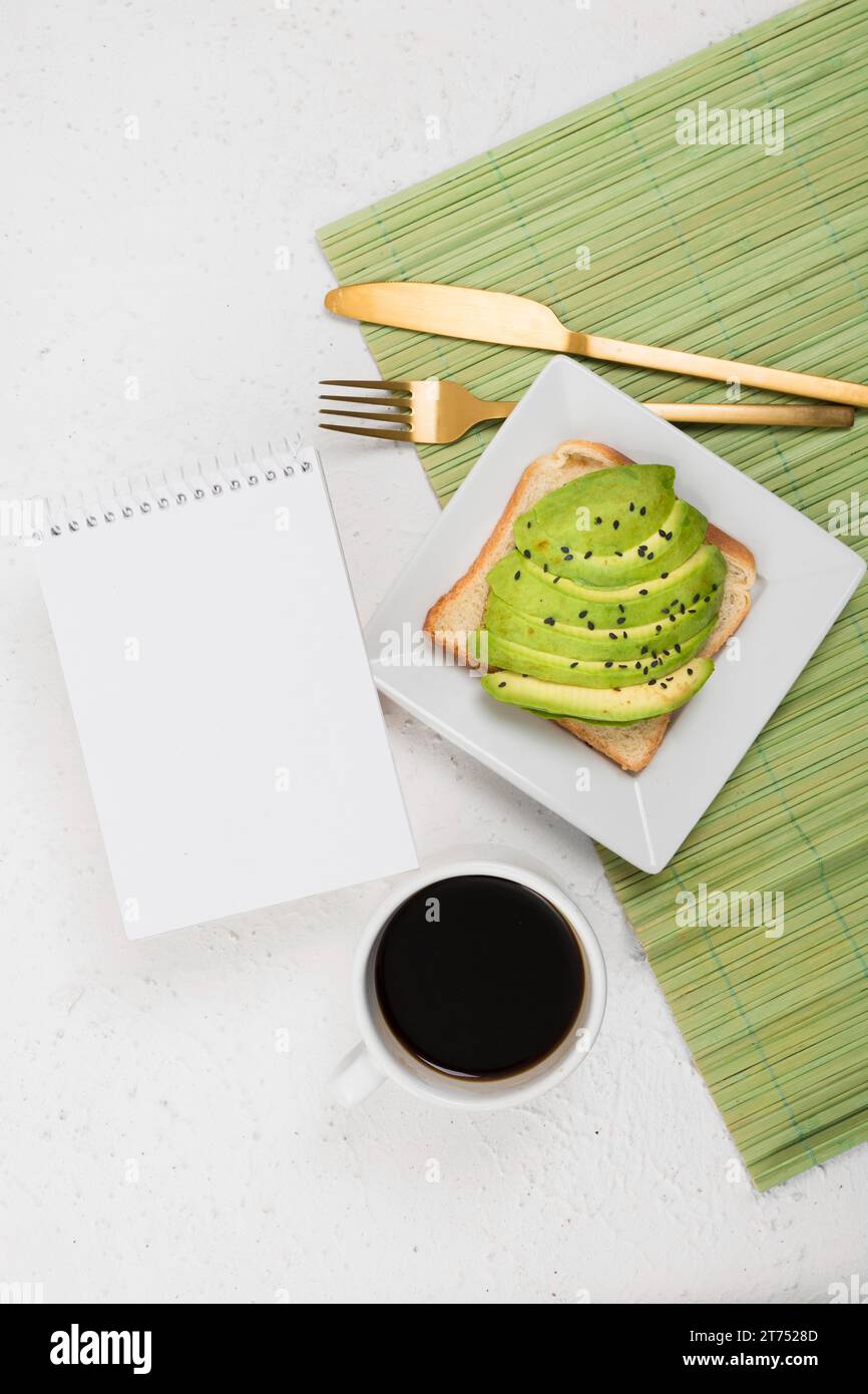 Flat lay delicious breakfast with avocado Stock Photo - Alamy