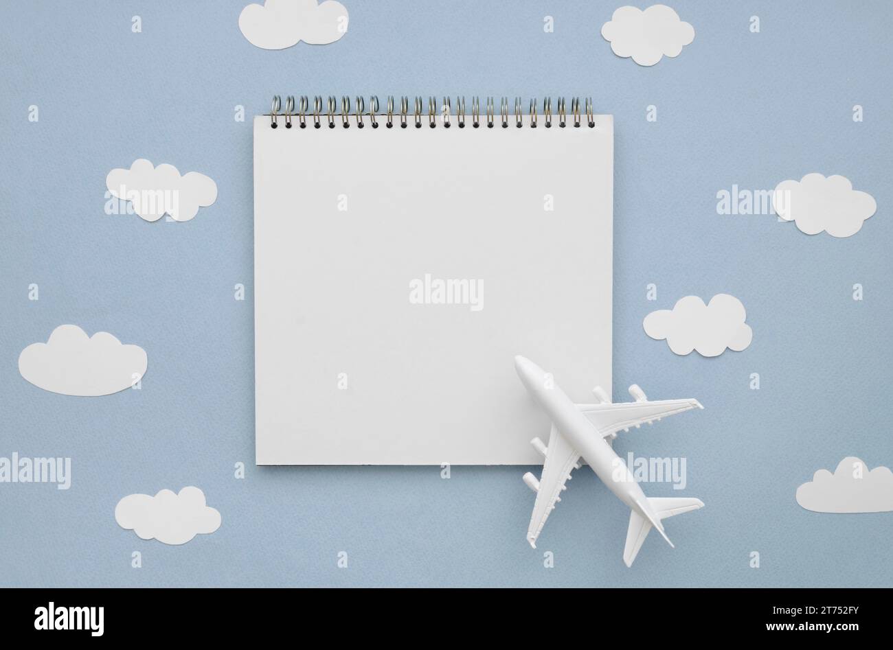 Frame clouds with airplane notebook Stock Photo - Alamy