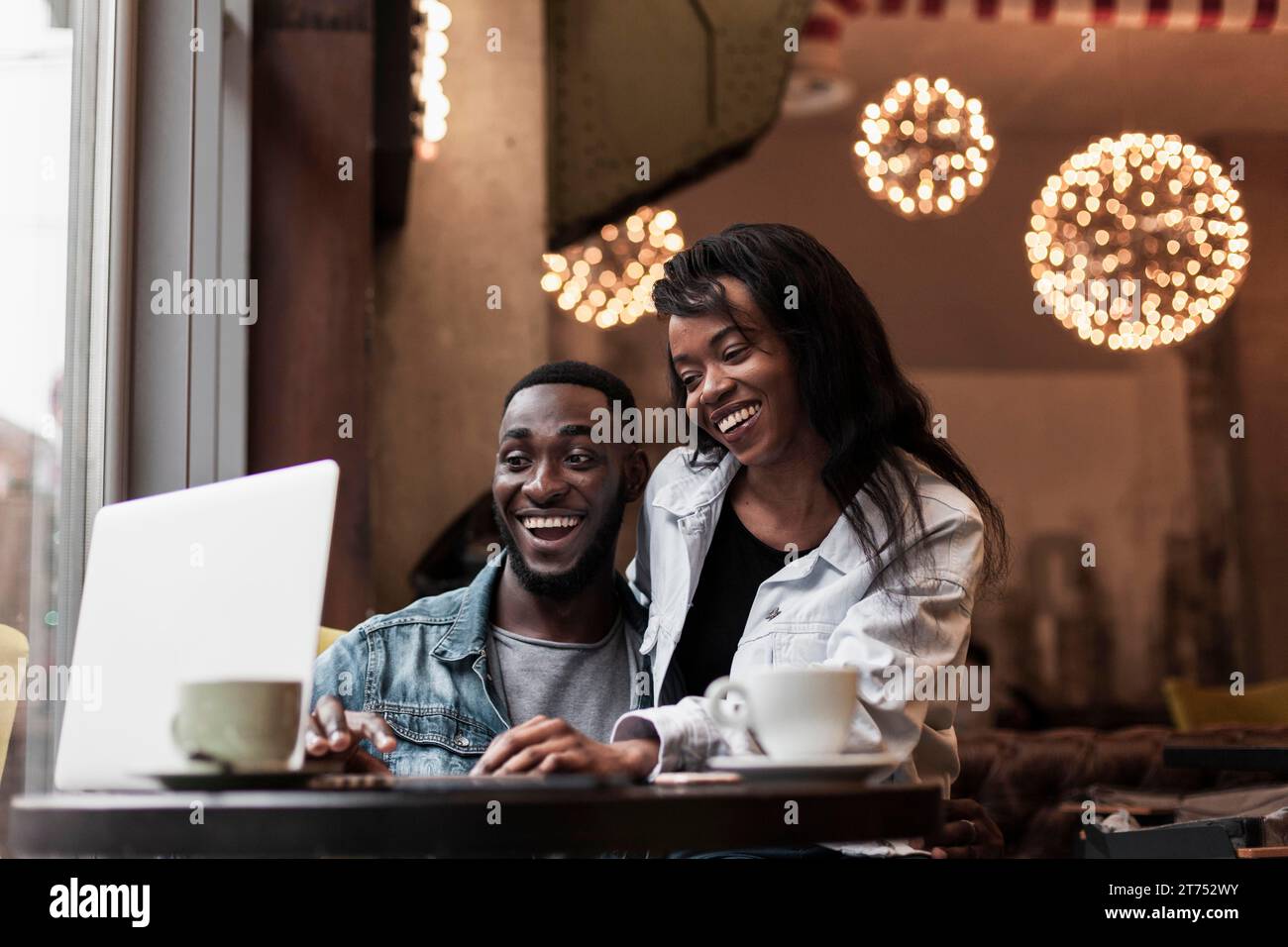 Diverse couple laptop hi-res stock photography and images - Alamy