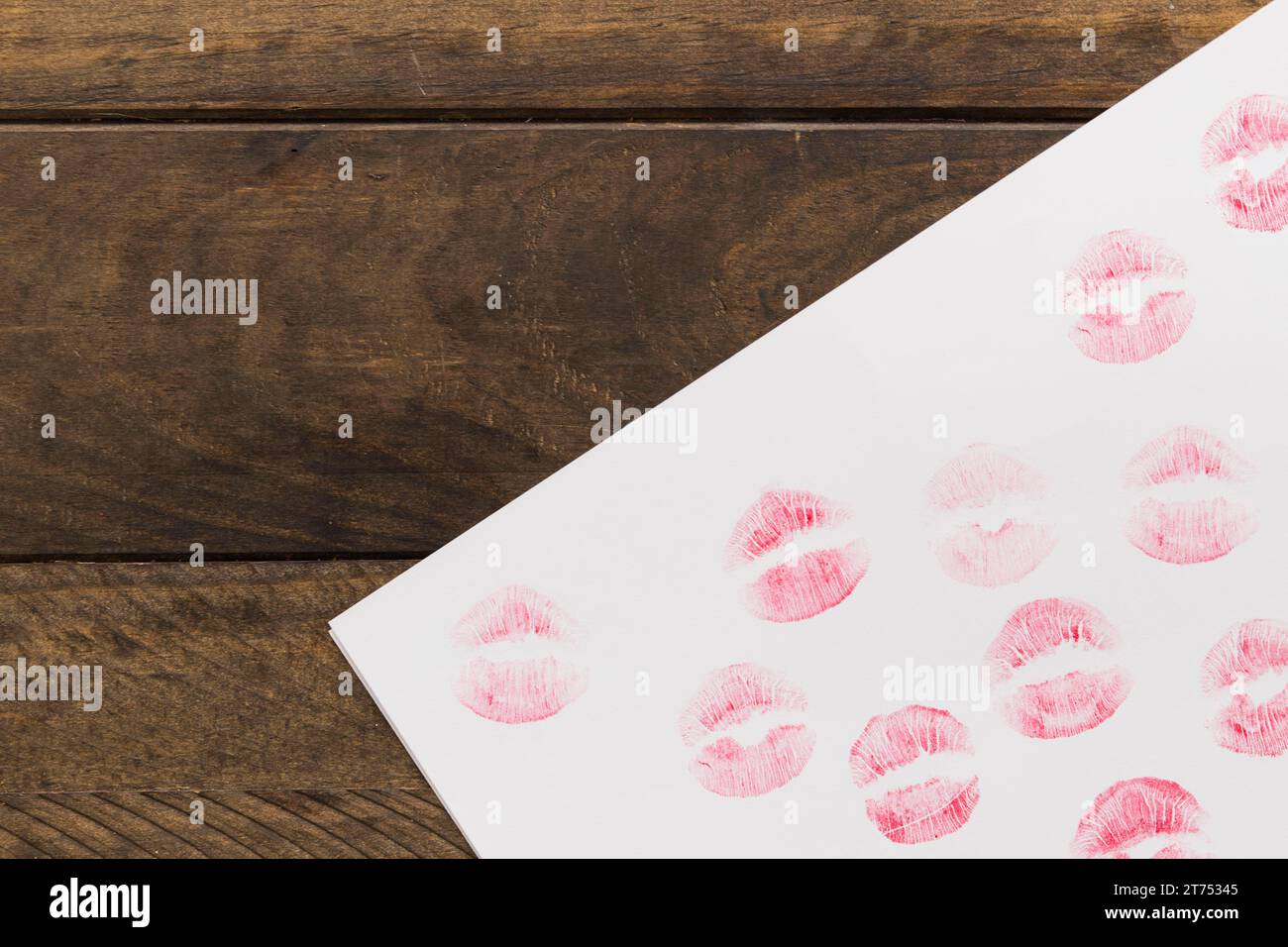 Lipstick kisses paper wooden board Stock Photo - Alamy