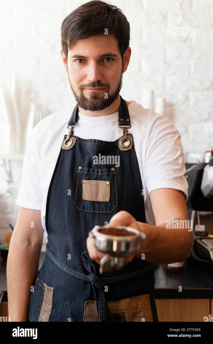 Medium shot barista work Stock Photo - Alamy