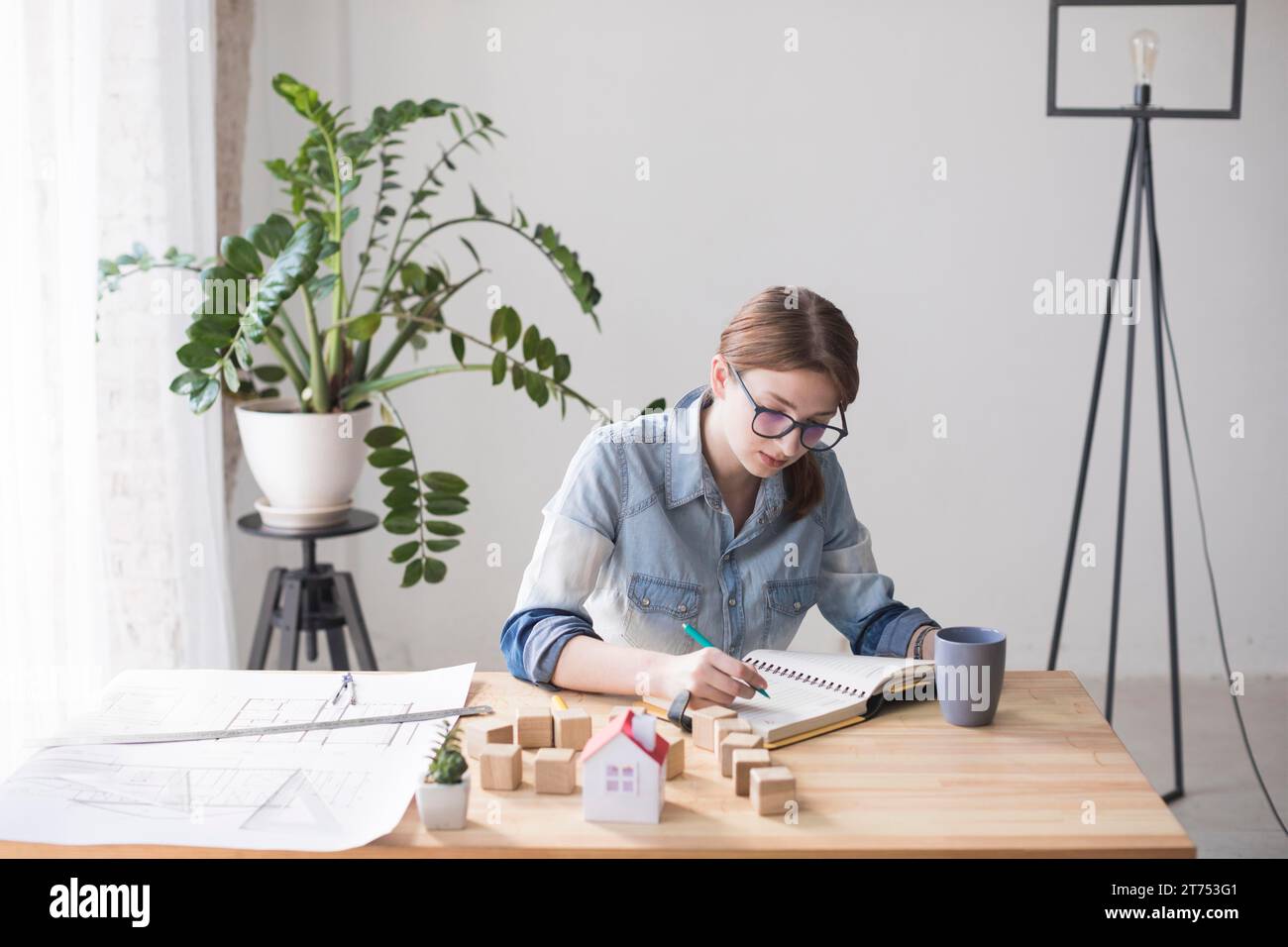 Overhead view female real estate agent working office Stock Photo - Alamy
