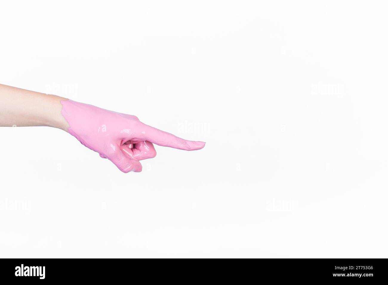Person s hand with pink paint pointing finger white background Stock ...