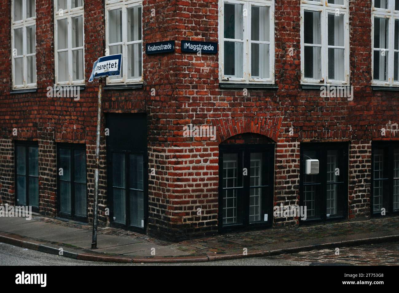 Old building corner paved street Stock Photo - Alamy