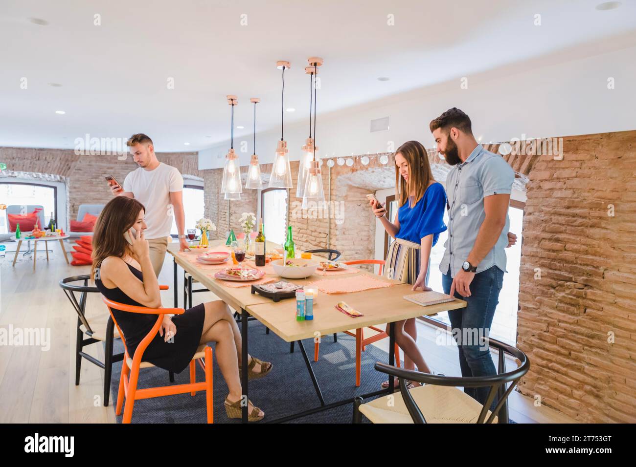 People party splitting around room Stock Photo - Alamy