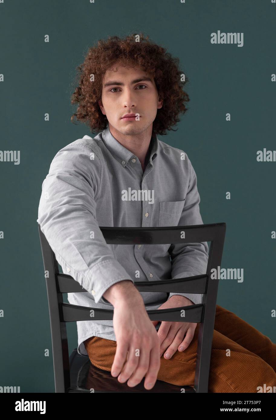 Portrait curly haired young man 12 Stock Photo - Alamy