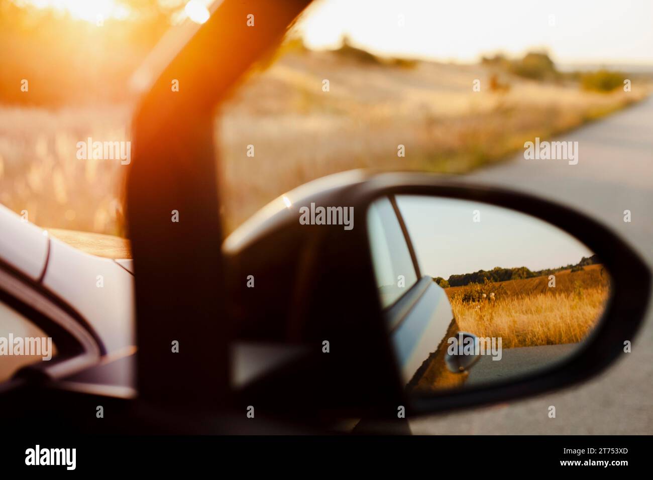 Rearview mirror sunset background Stock Photo - Alamy