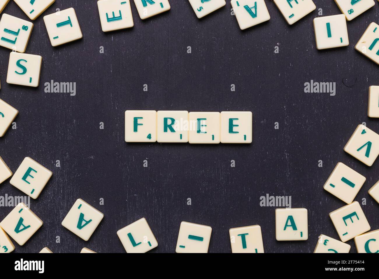 Scrabble letters black background Stock Photo - Alamy