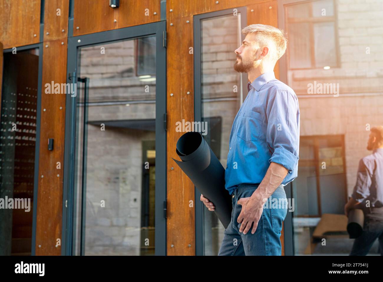 Side view architect holding blueprints Stock Photo - Alamy Side view architect holding blueprints Stock Photo - Alamy