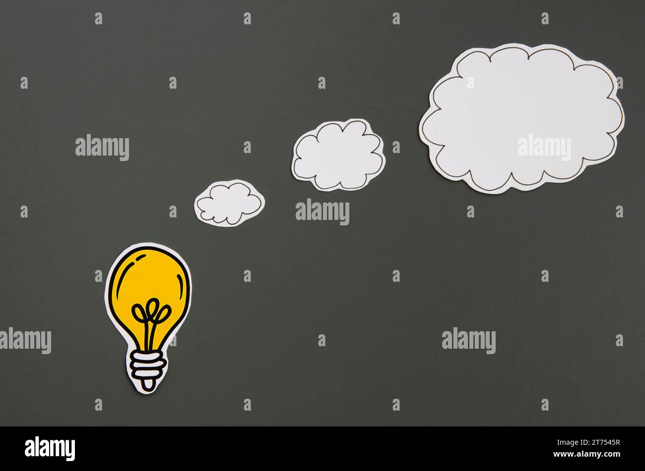 Speech bubbles idea concept light bulb black background Stock Photo - Alamy