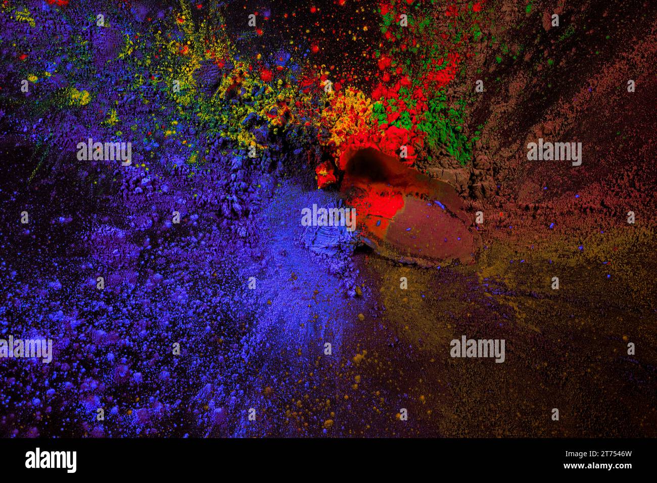 Splatter holi color powder black surface Stock Photo - Alamy