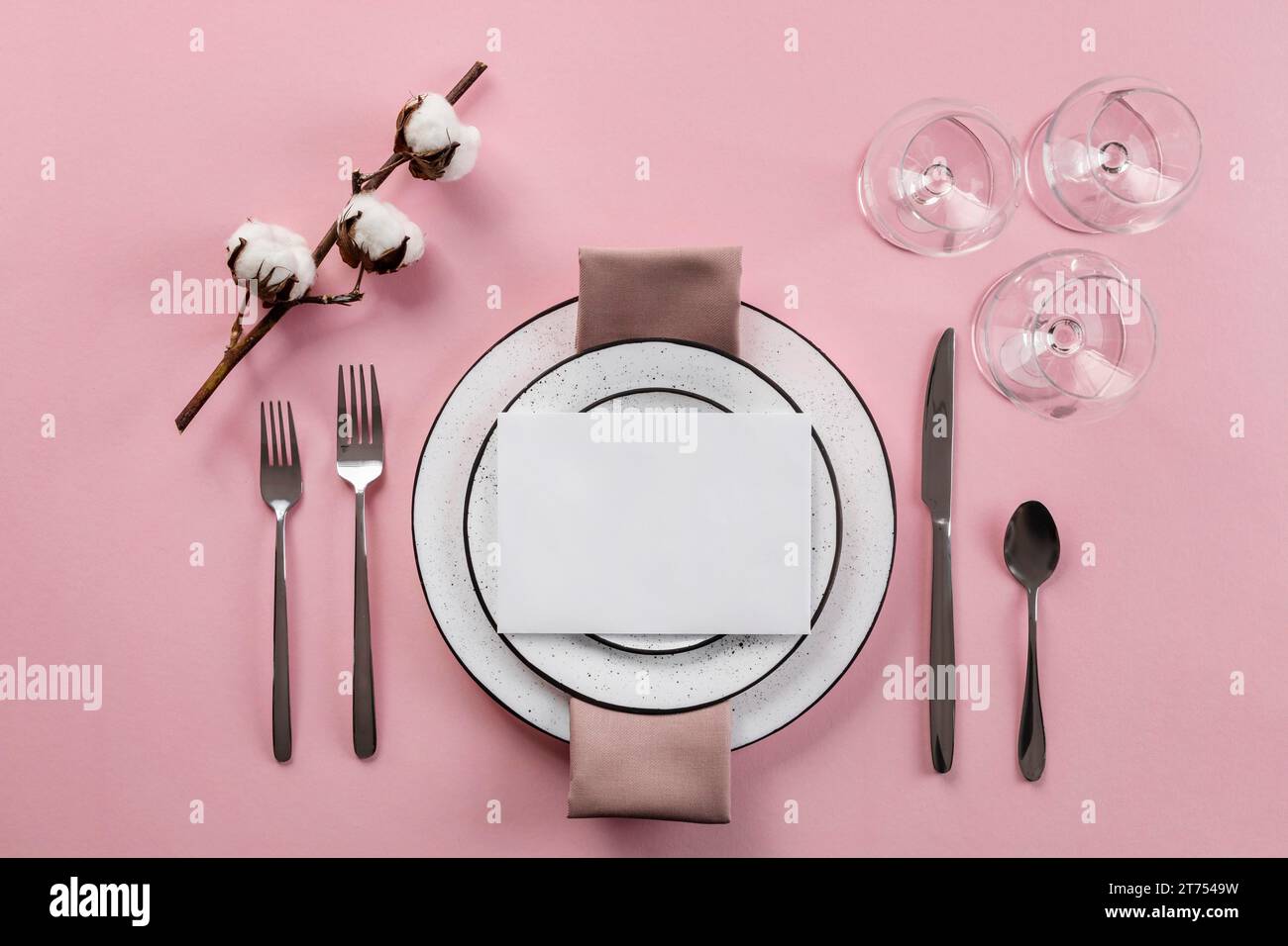 Table etiquette with pink background flat lay Stock Photo - Alamy