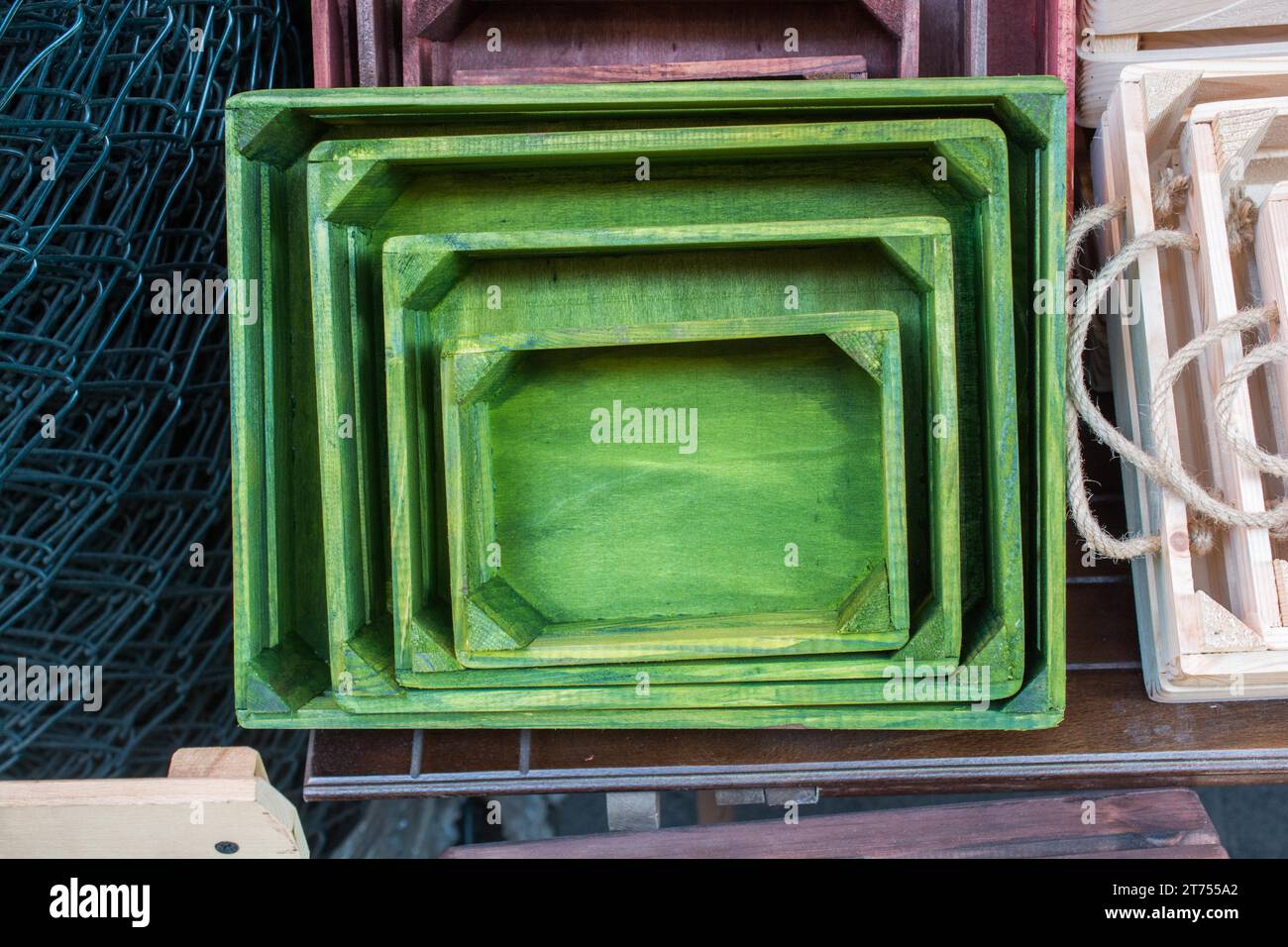 Colorful wooden crate boxes for sale in a market Stock Photo - Alamy