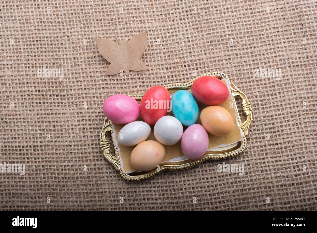 Paper Butterfly on Colorful candy sweets in tray Stock Photo - Alamy