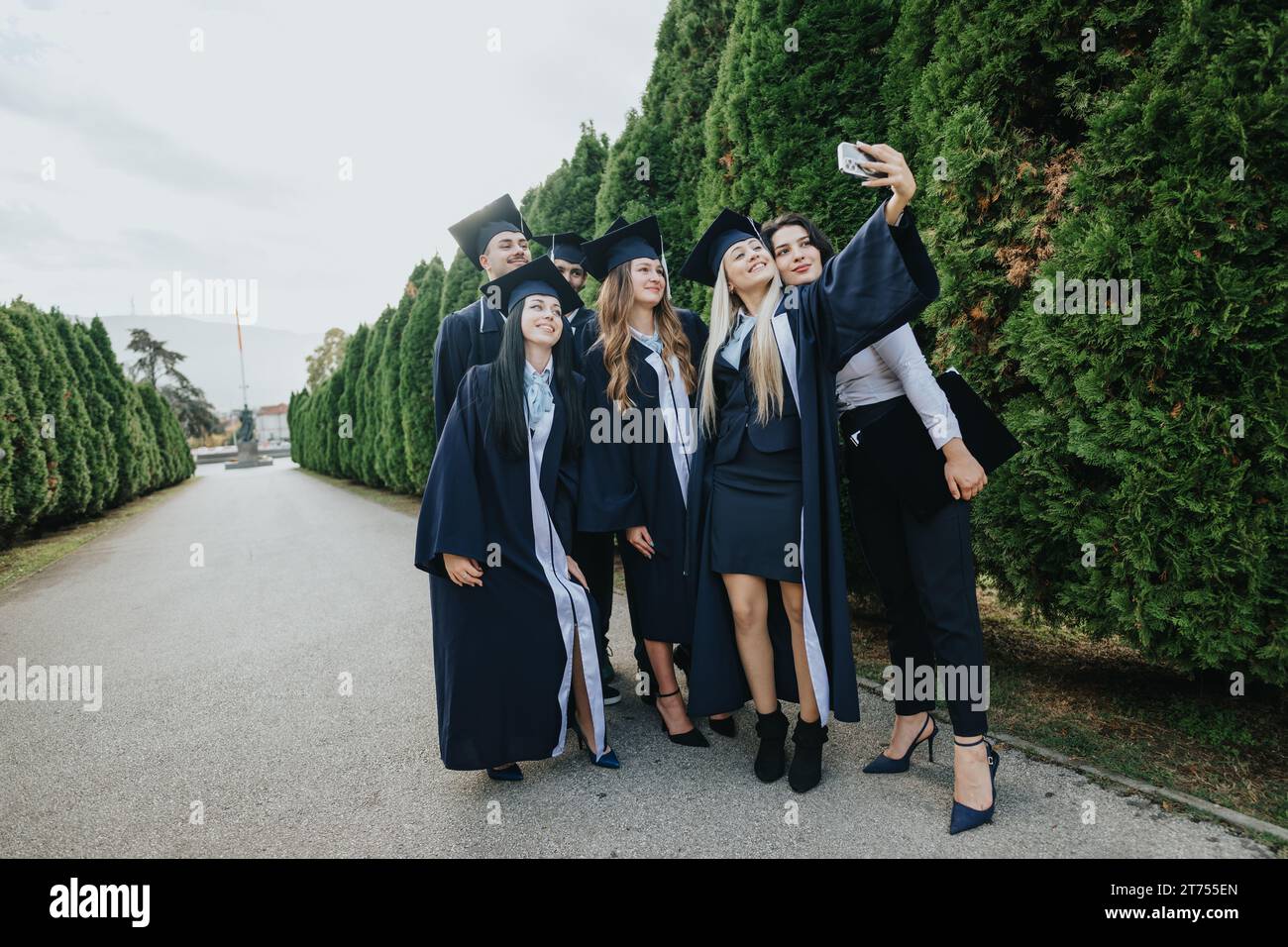 Celebrate Your Achievements with Friends. Graduates Taking Selfies ... Celebrate Your Achievements with Friends. Graduates Taking Selfies ...
