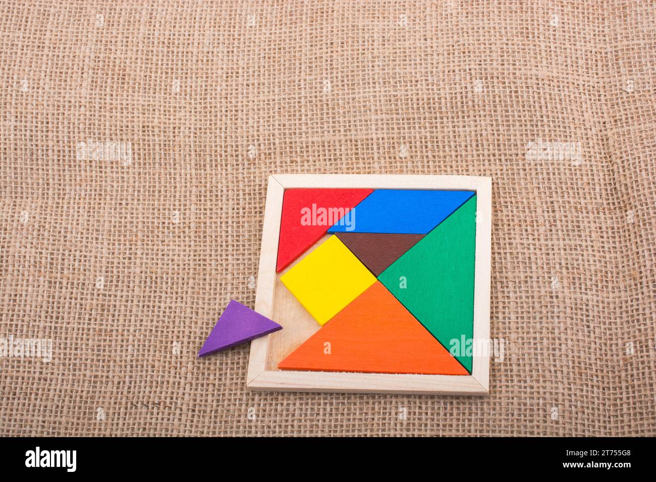 Colorful pieces of a square tangram puzzle Stock Photo - Alamy