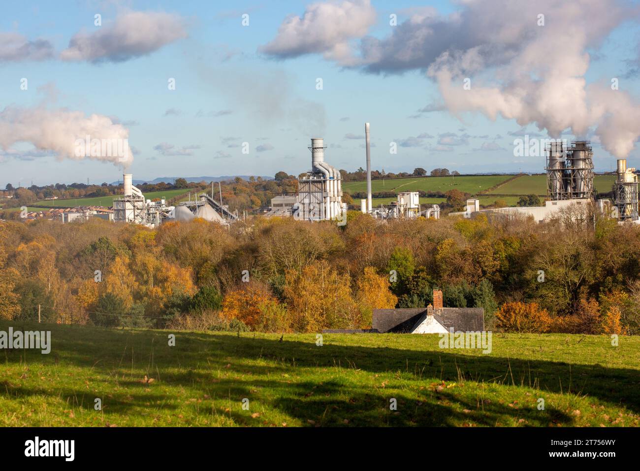 View over Autumn trees of the Kronospan factory which makes wood-based ...