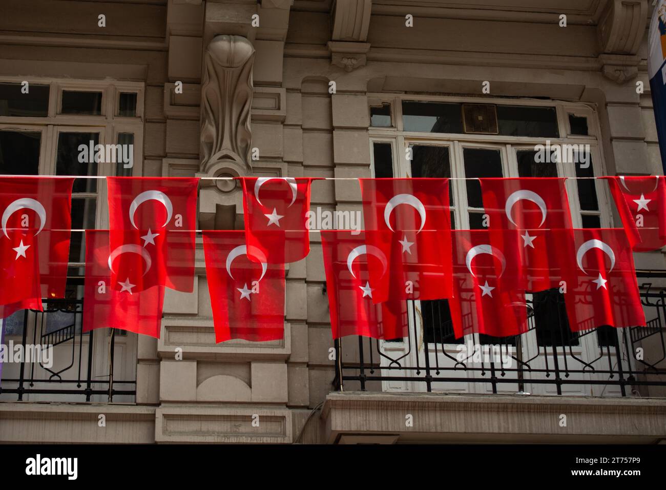 Turkish national flag hang on a pole on a rope in the street in open ...