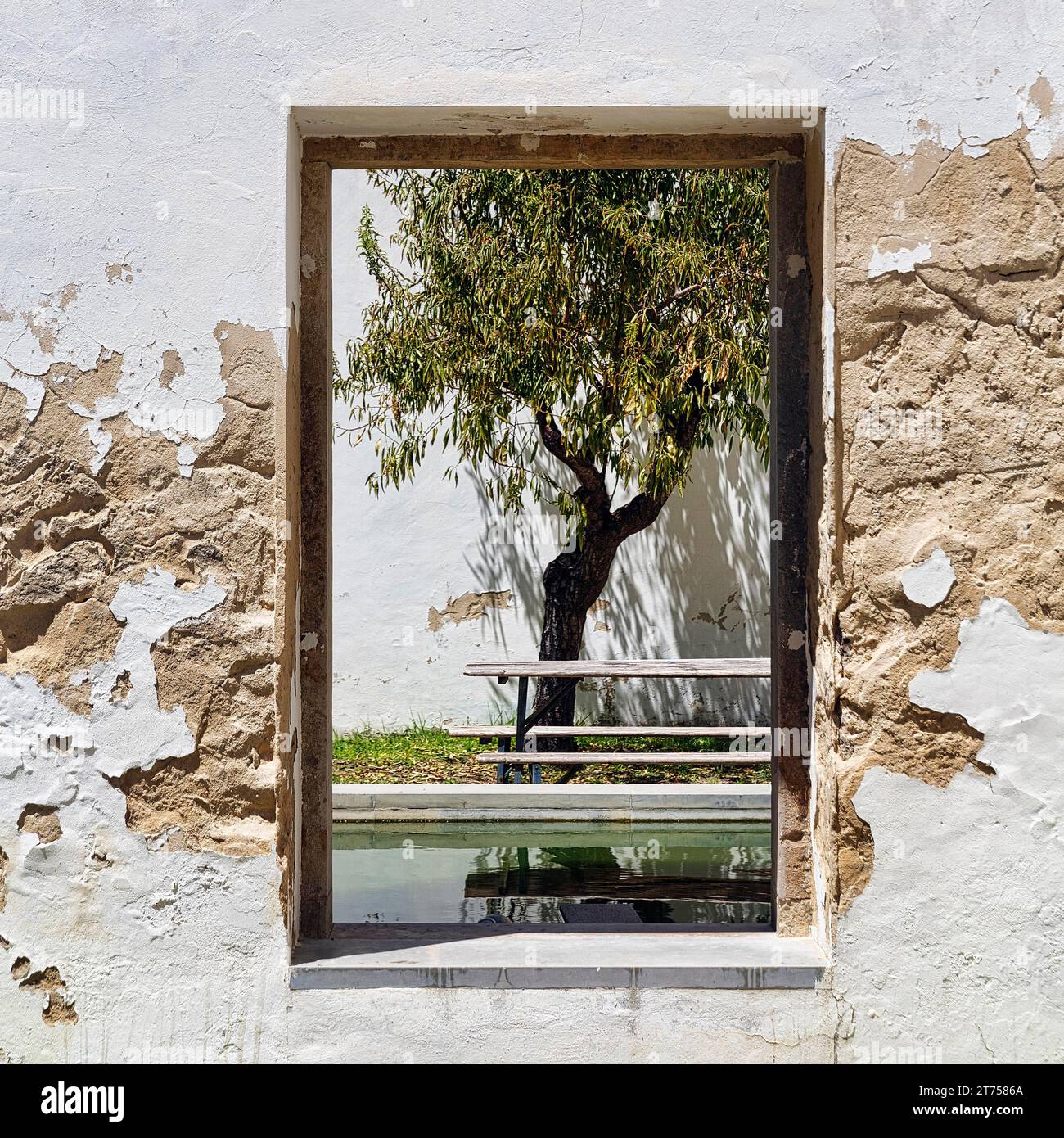 Window in a wall, inner courtyard of the Biblioteca Municipal Alvaro de ...