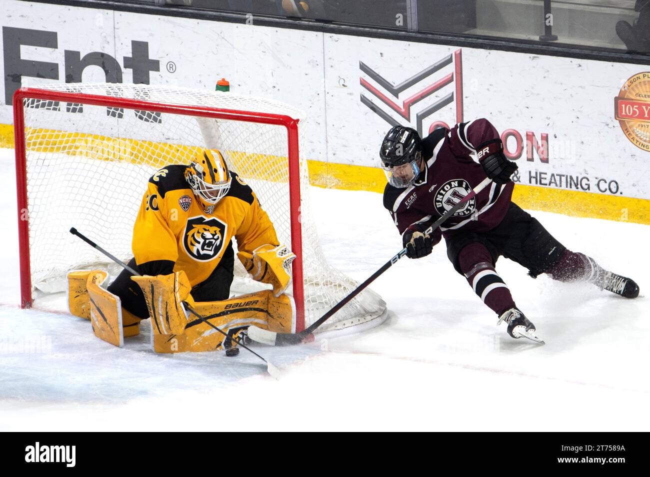 Goalie Kaidan Mbereko of Colorado College makes a save during a college ...