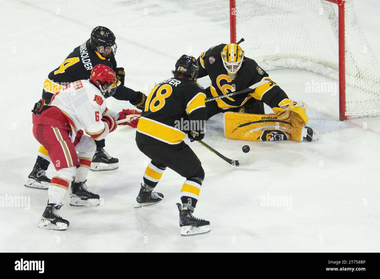 Goalie Kaidan Mbereko of Colorado College makes a save during a college ...