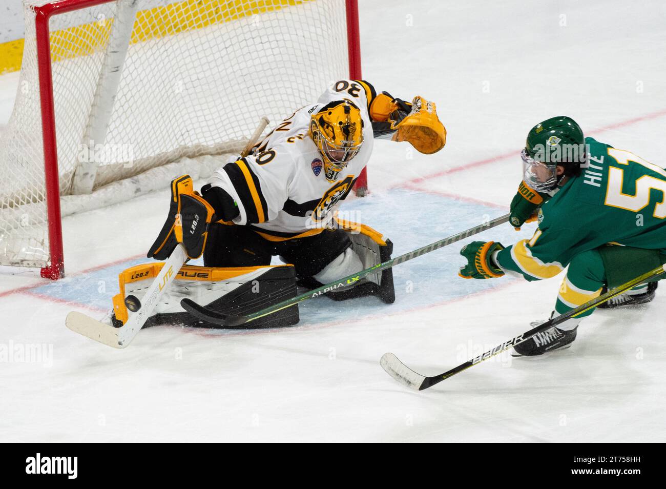 Colorado College goalie Matt Vernon (30) makes a save against a player ...