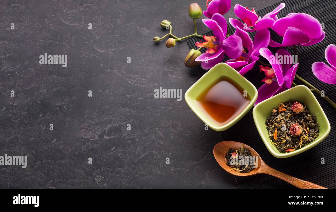 Organic dried tea herb pink orchid flower black background Stock Photo ...