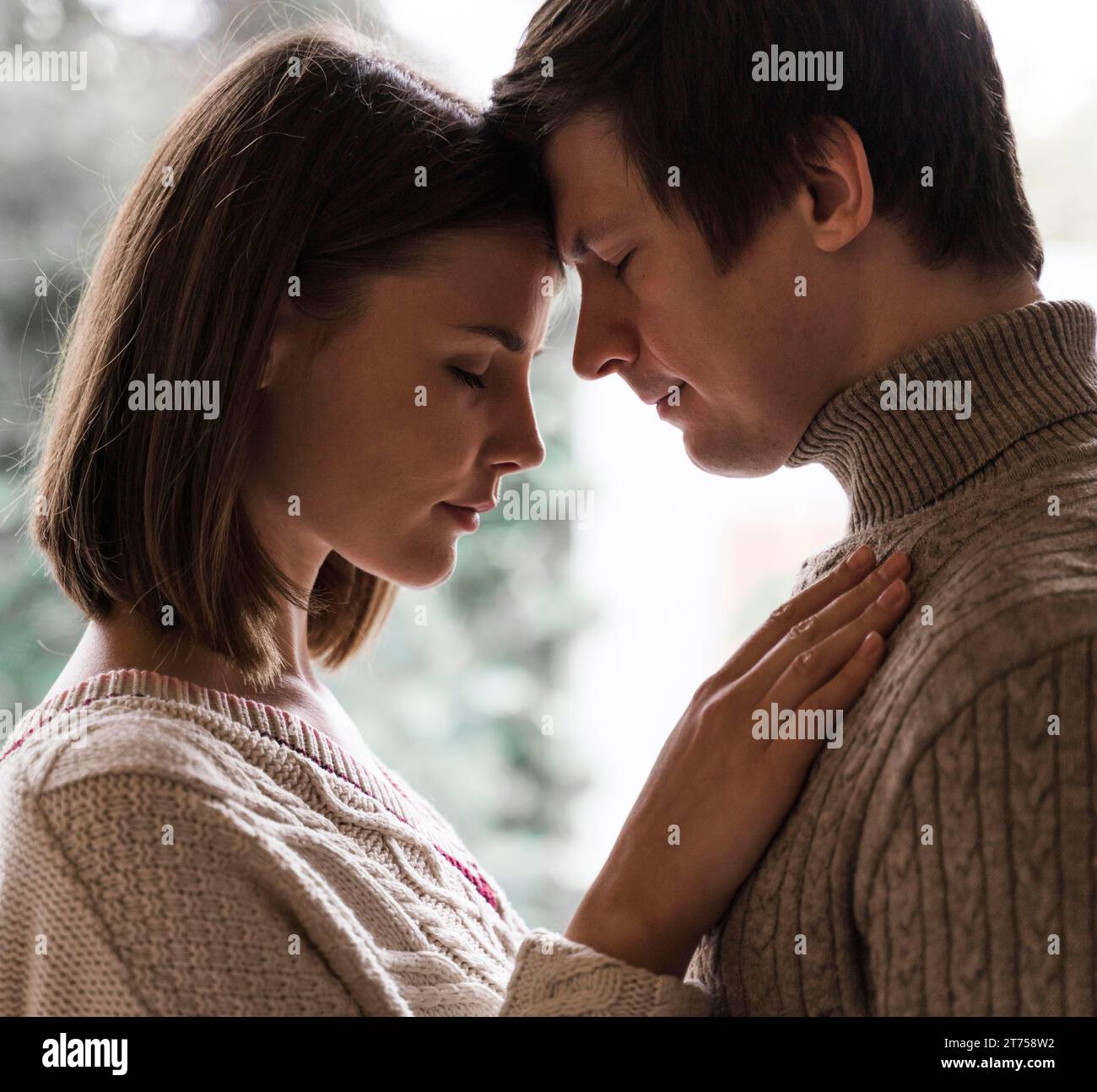 Adult woman hugging her husband Stock Photo - Alamy