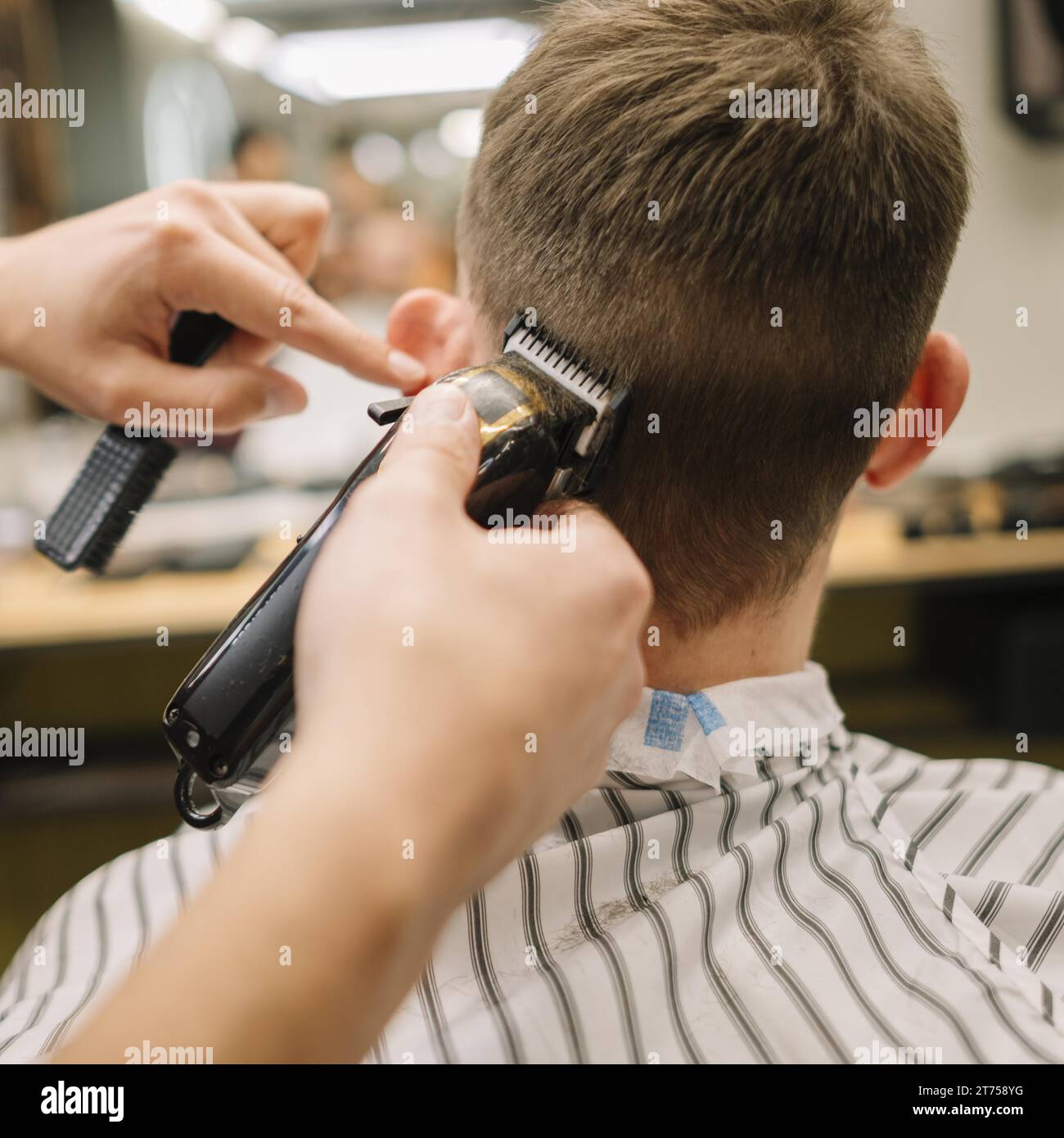 Back view man getting haircut Stock Photo - Alamy