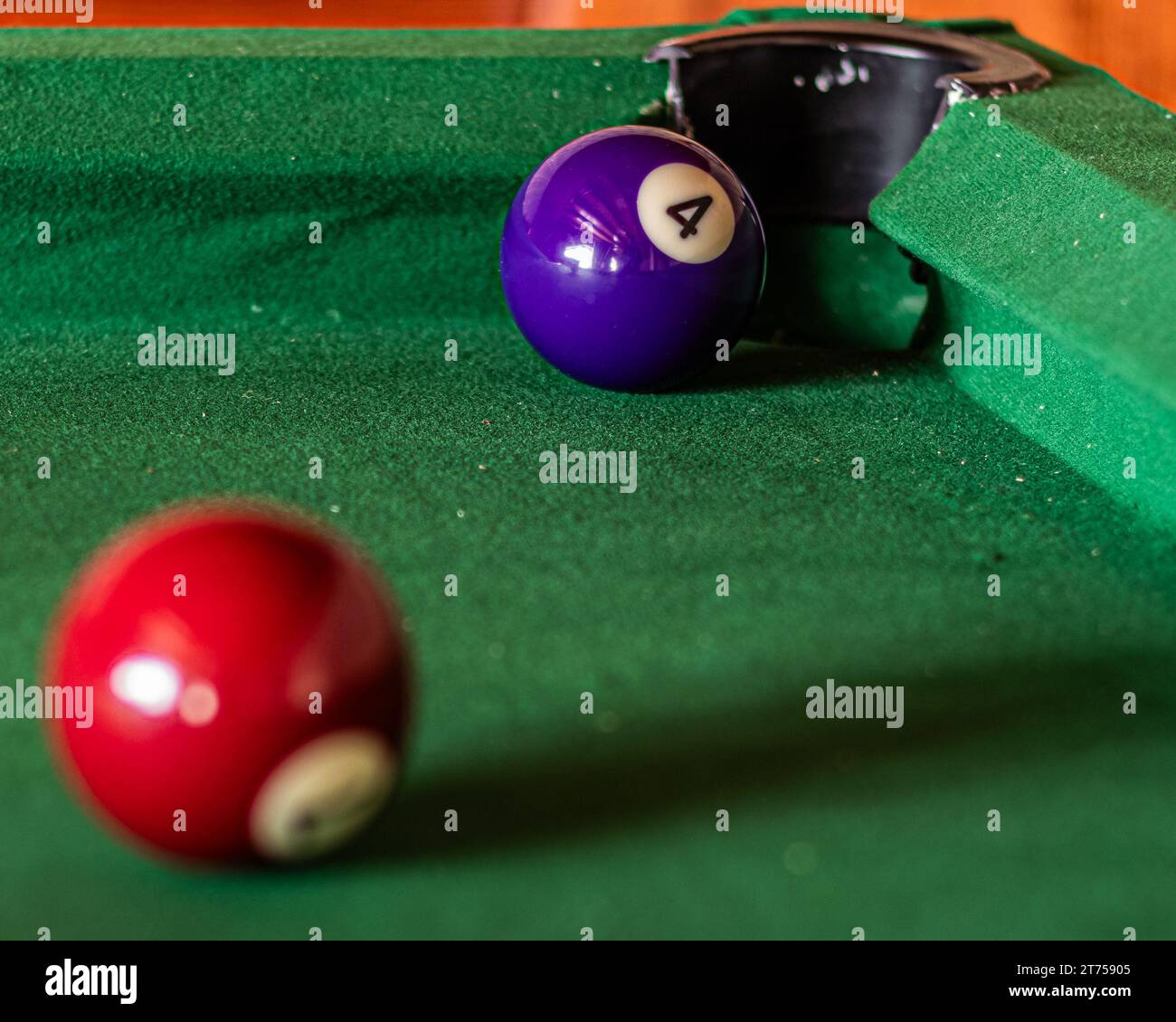 Billiard table setup featuring colorful pool balls, ready for an ...