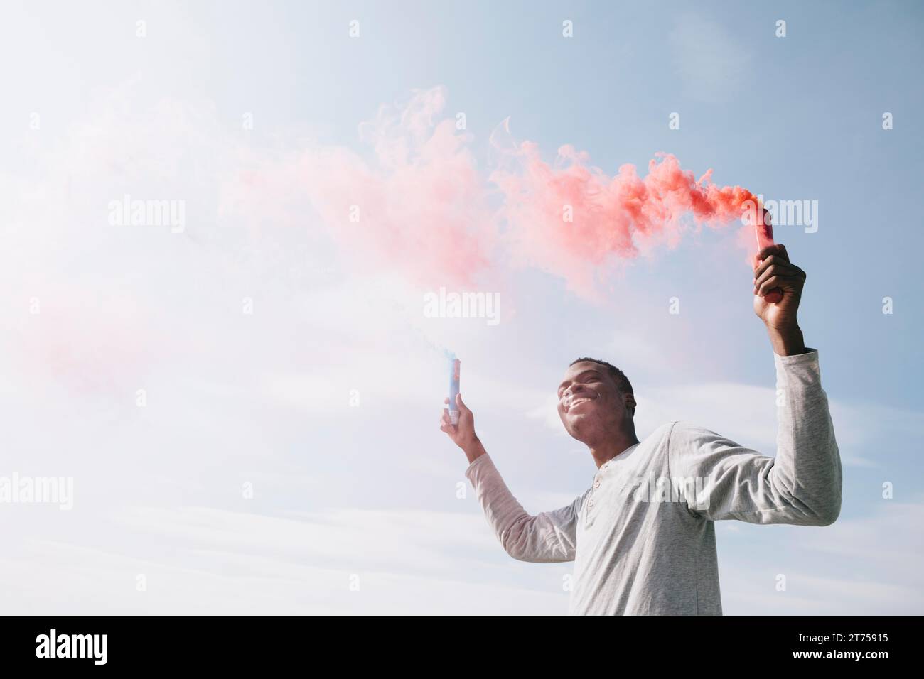 Person holding smoke bomb hi-res stock photography and images - Alamy