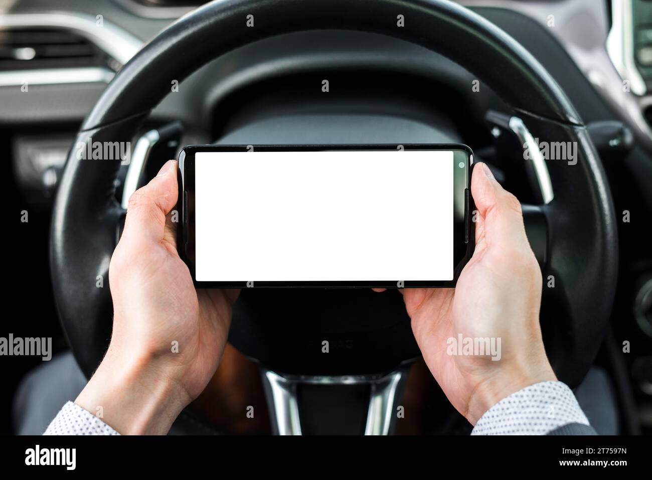 Close up businessman s hand holding smartphone front steering wheel ...