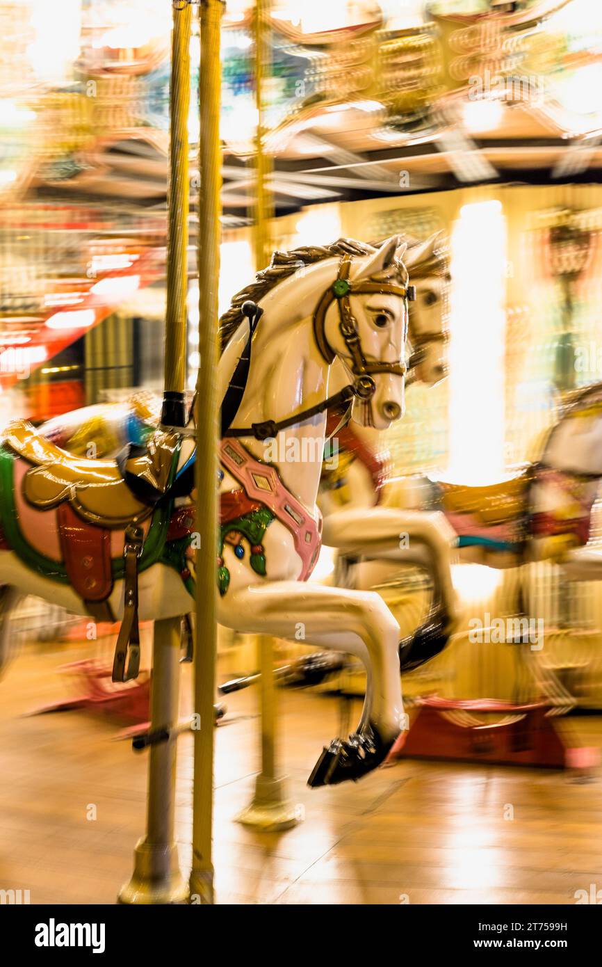 Close up illuminated detail carousel horses Stock Photo - Alamy