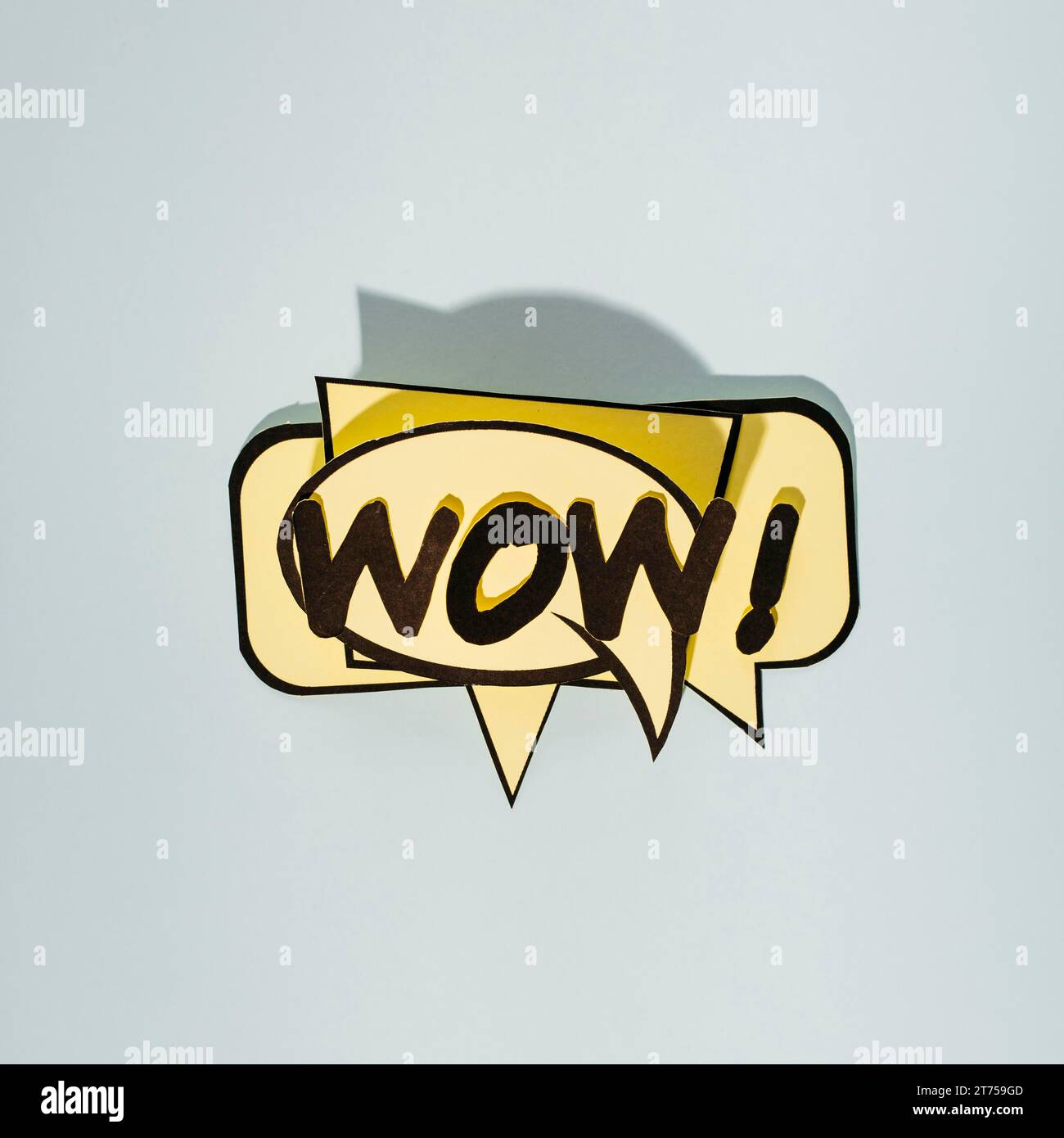 Comics wow text beige speech bubbles gray backdrop Stock Photo - Alamy