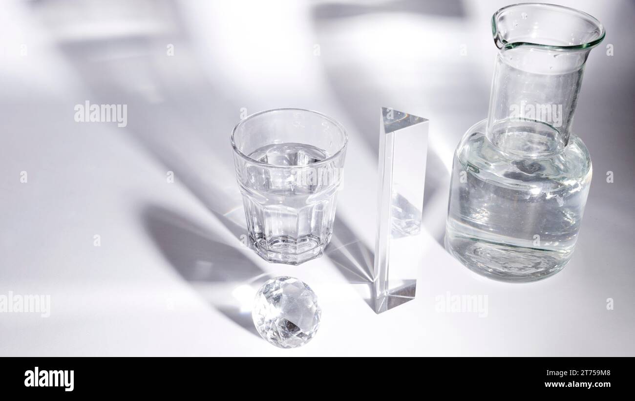 Diamond glass water prism beaker with shadow white backdrop Stock Photo ...