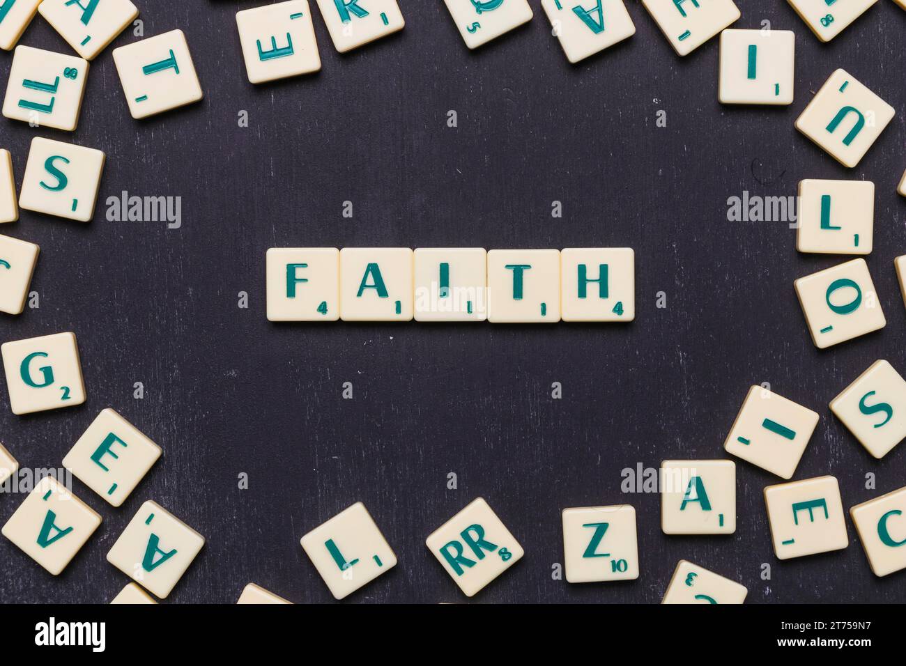 Faith scrabble letters black background Stock Photo - Alamy