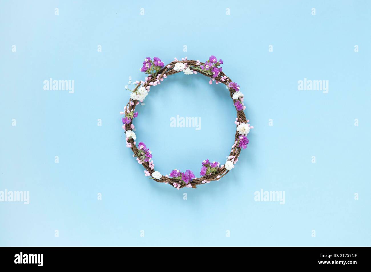 Elevated view wreath made up flowers blue backdrop Stock Photo - Alamy