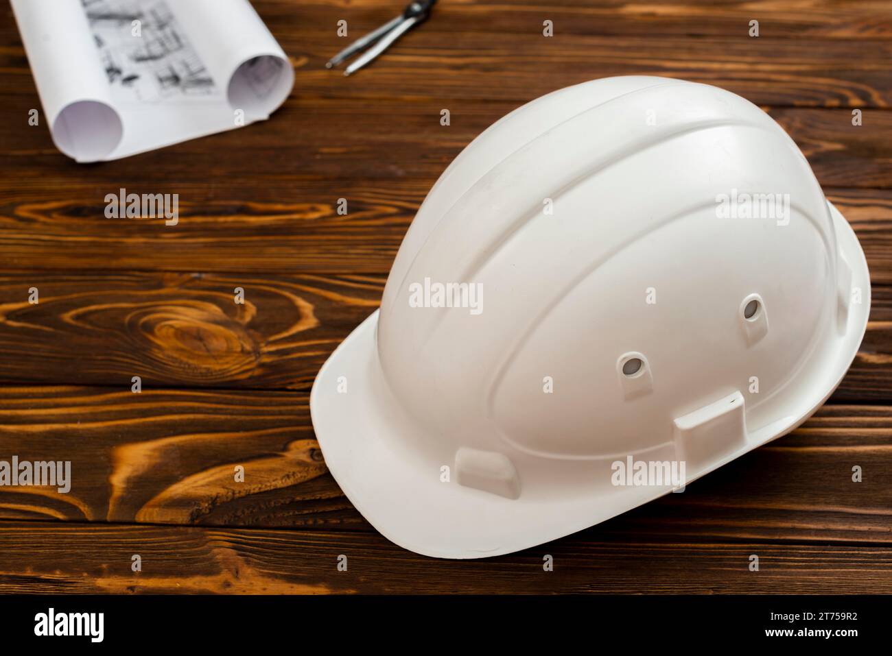 Flat lay construction helmet with plans background Stock Photo - Alamy