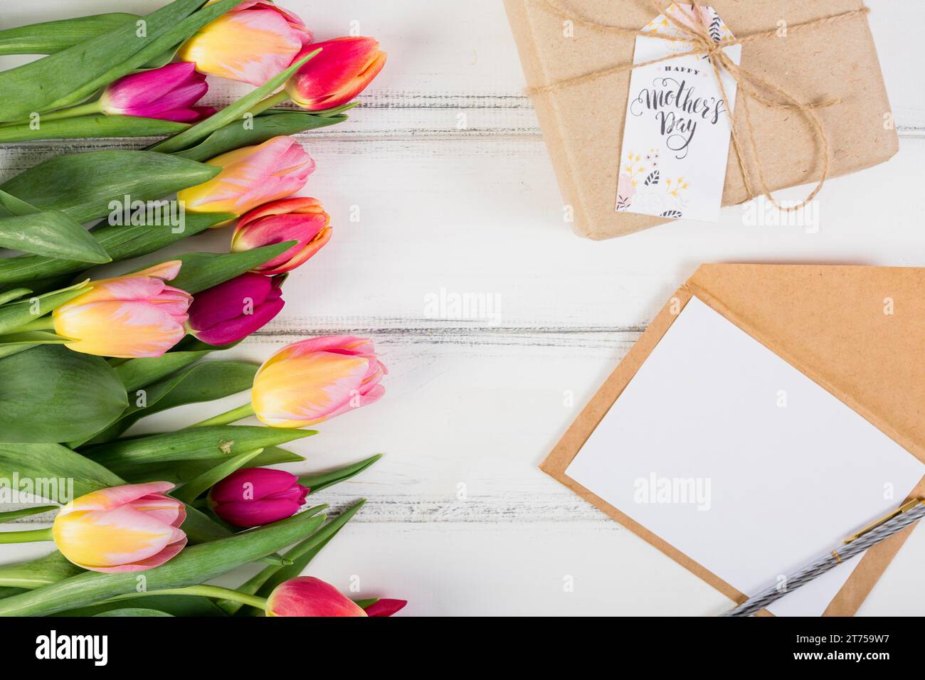 Frame letter gift box with tulips Stock Photo - Alamy